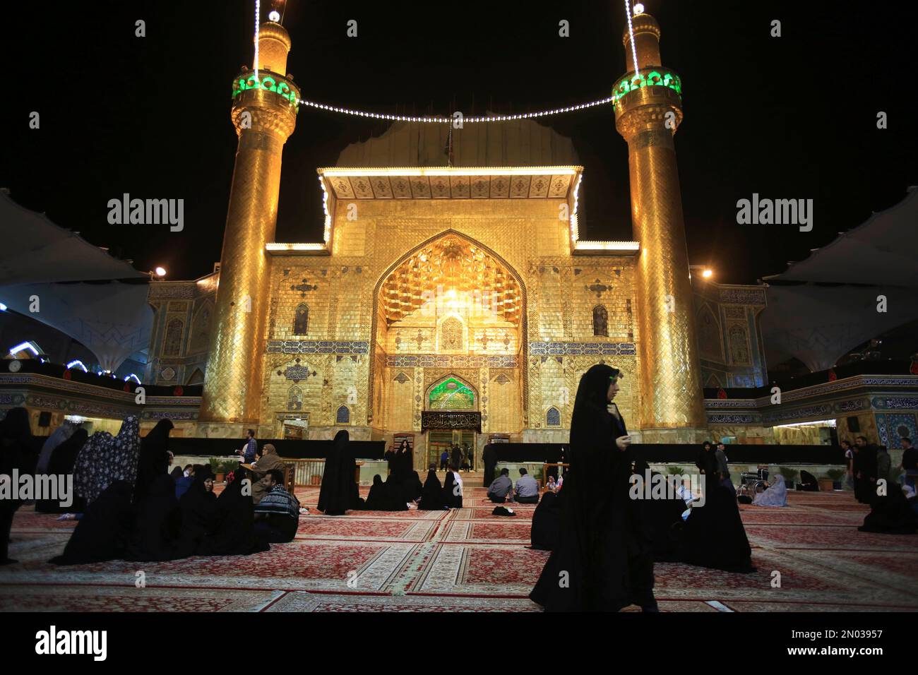 Shiite Muslim pilgrims visit the holy shrine of Imam Ali, the son-in ...
