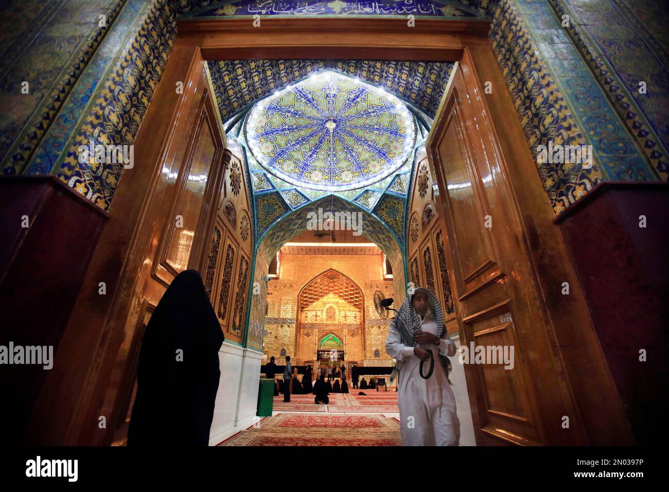 Shiite Muslim pilgrims visit the holy shrine of Imam Ali, the son-in ...