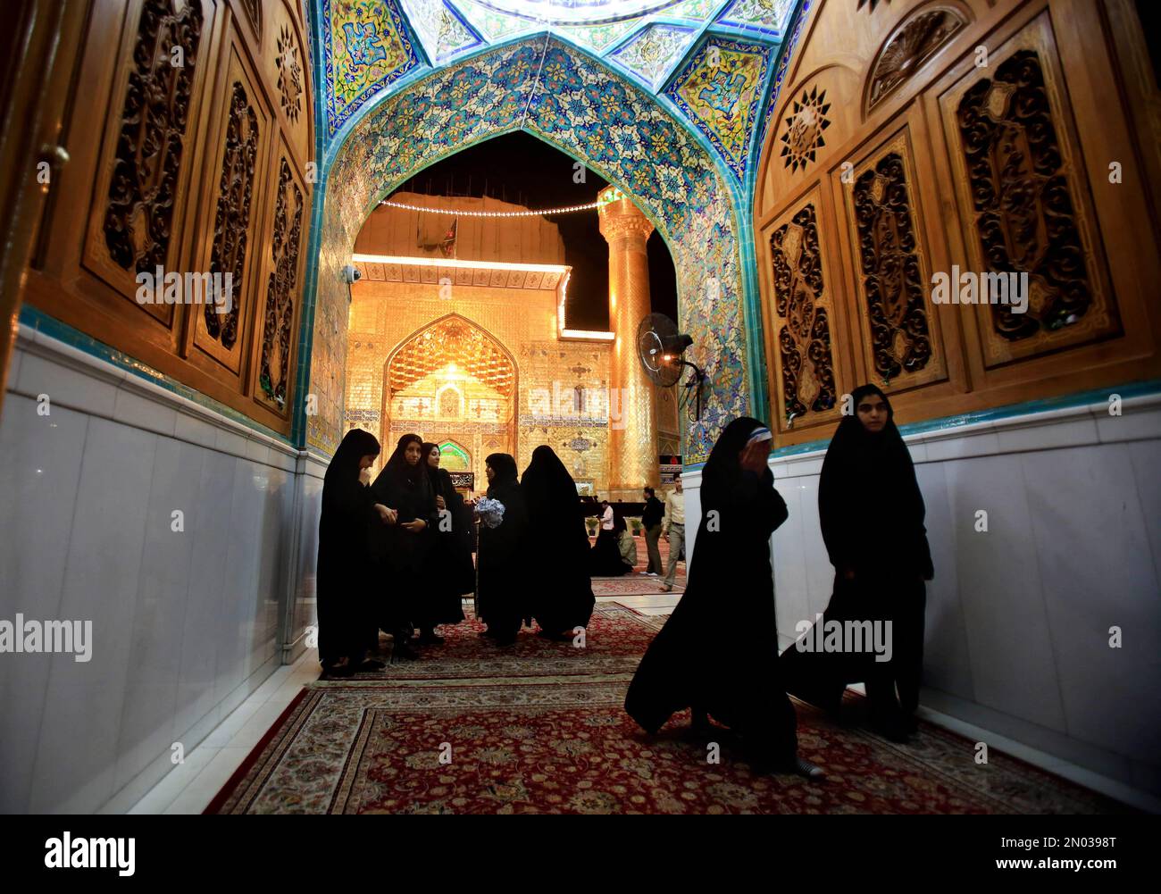 Shiite Muslim pilgrims visit the holy shrine of Imam Ali, the son-in ...