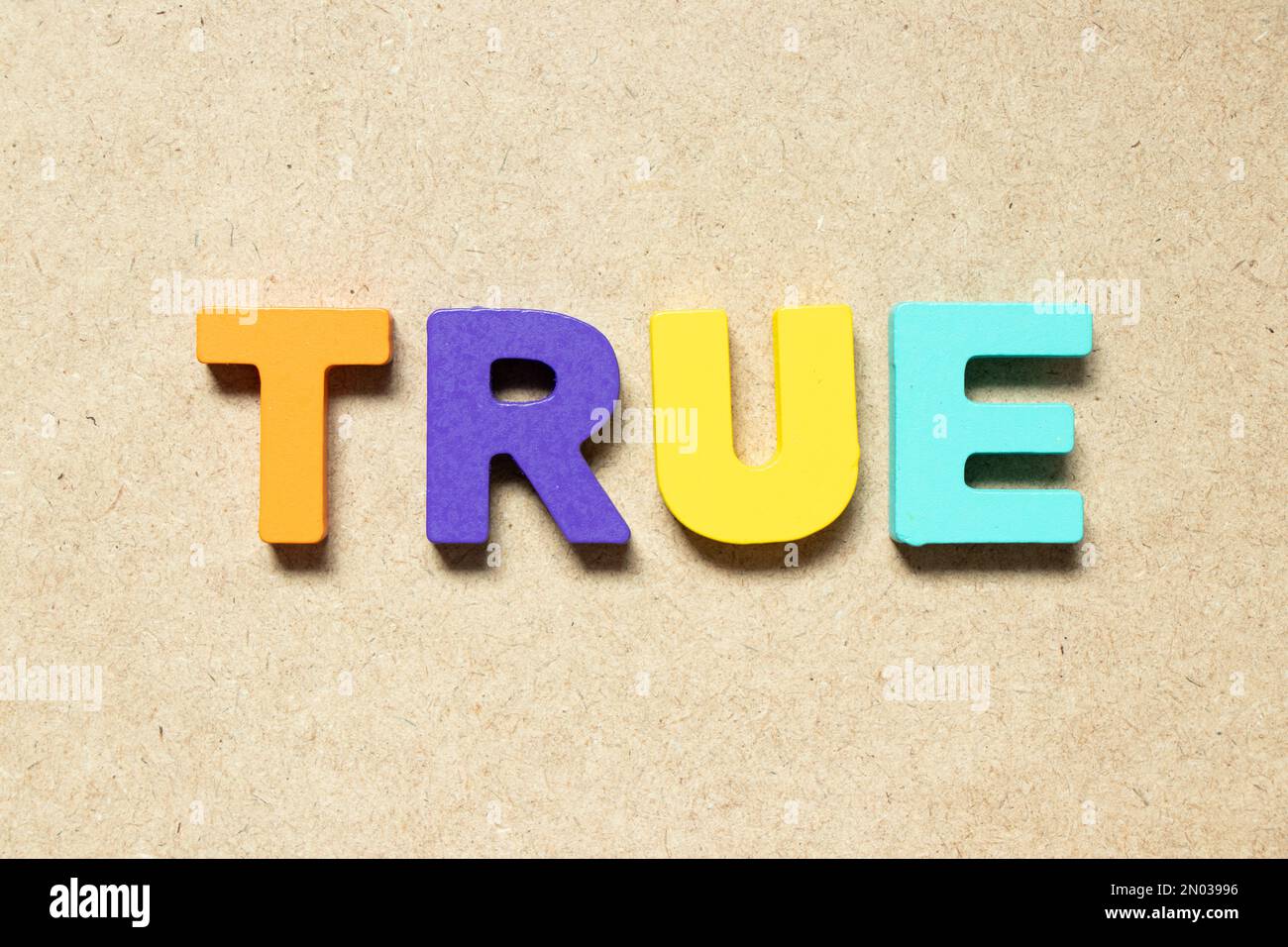 Color alphabet letter in word true on wood background Stock Photo - Alamy