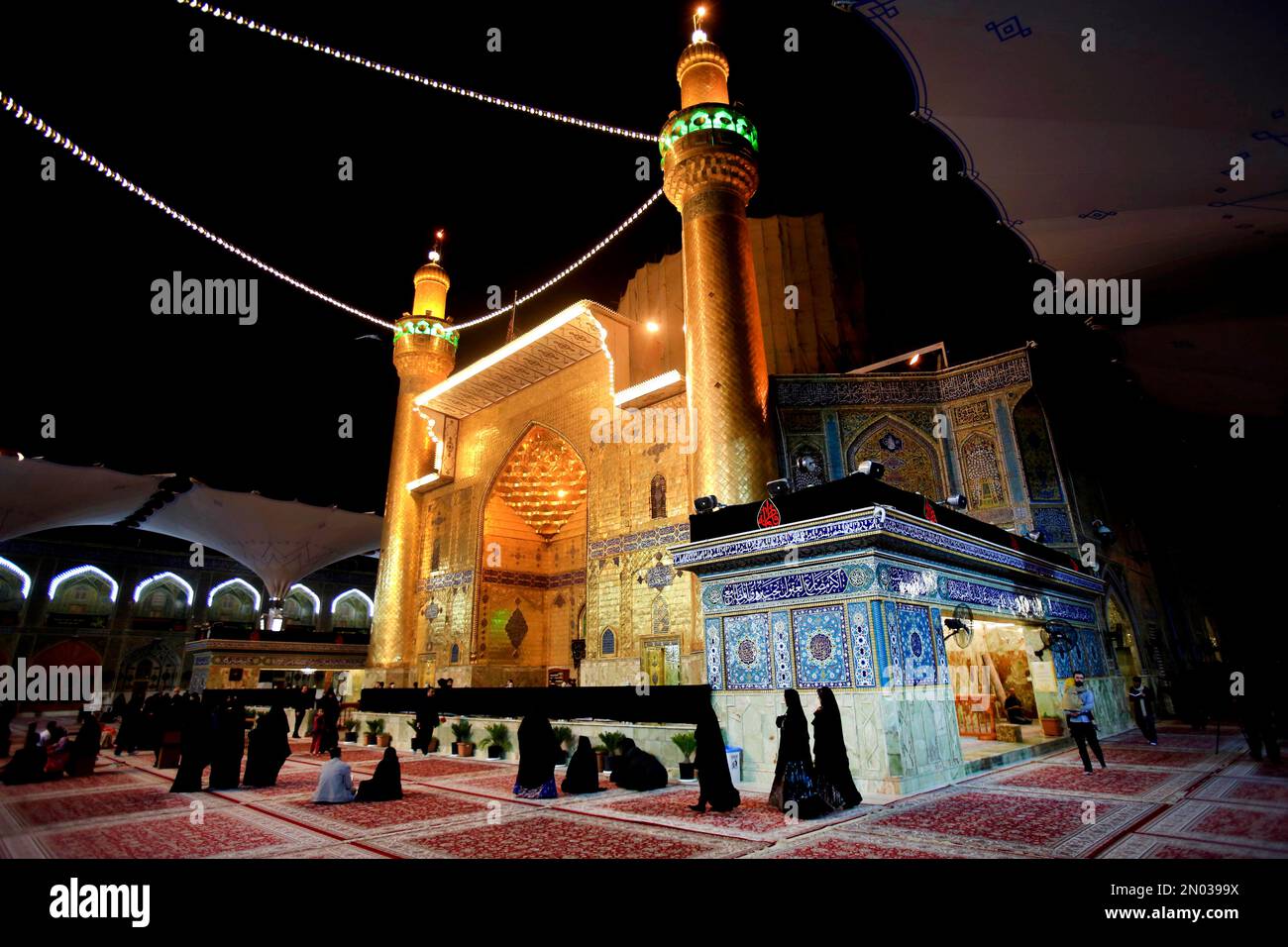Shiite Muslim pilgrims visit the holy shrine of Imam Ali, the son-in ...