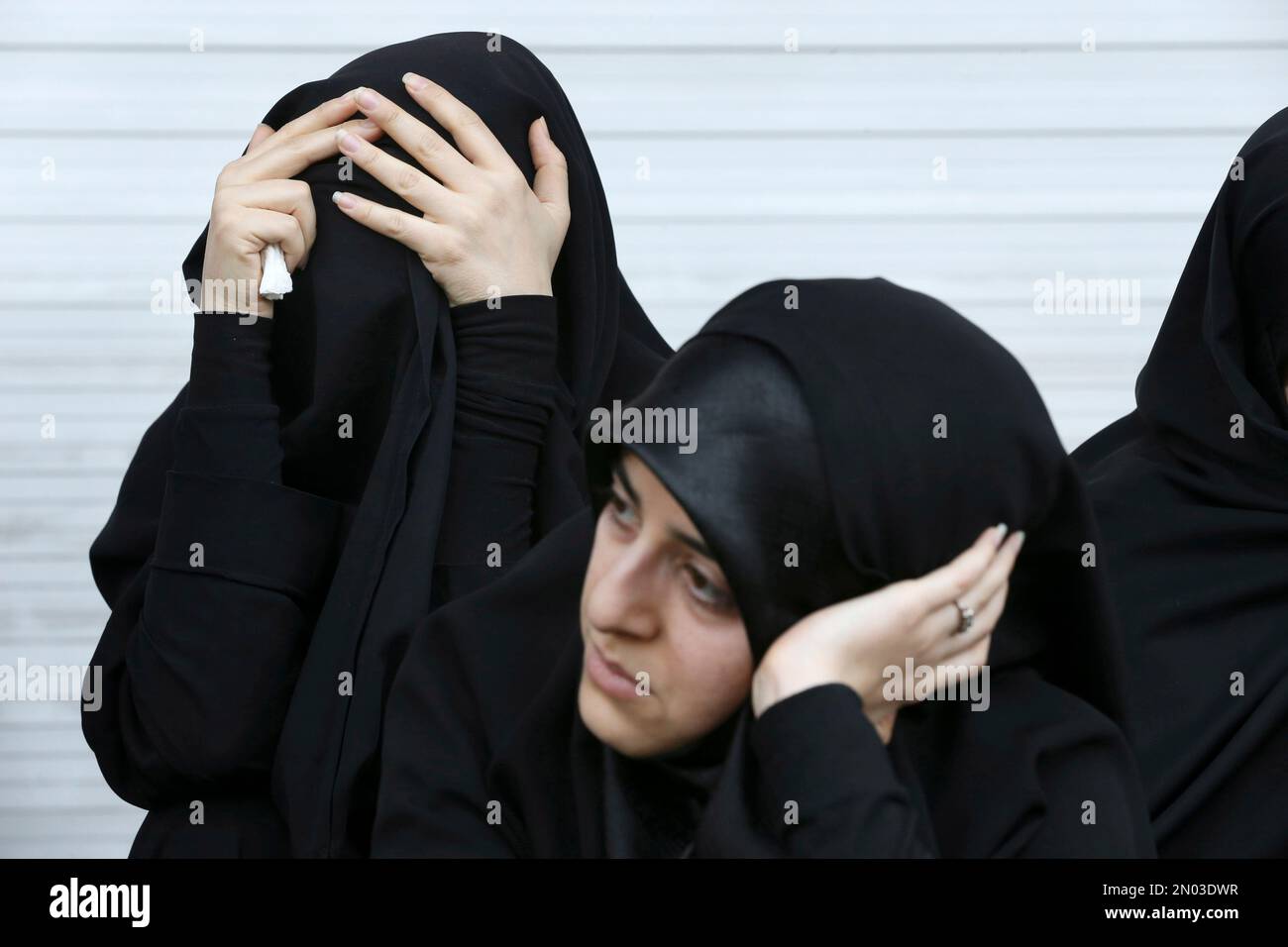 Iranian women mourn during a ceremony commemorating the death of Fatima ...