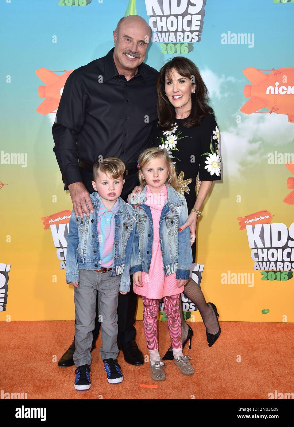 Phil McGraw, left, and Robin McGraw, and their grandchildren arrive at ...