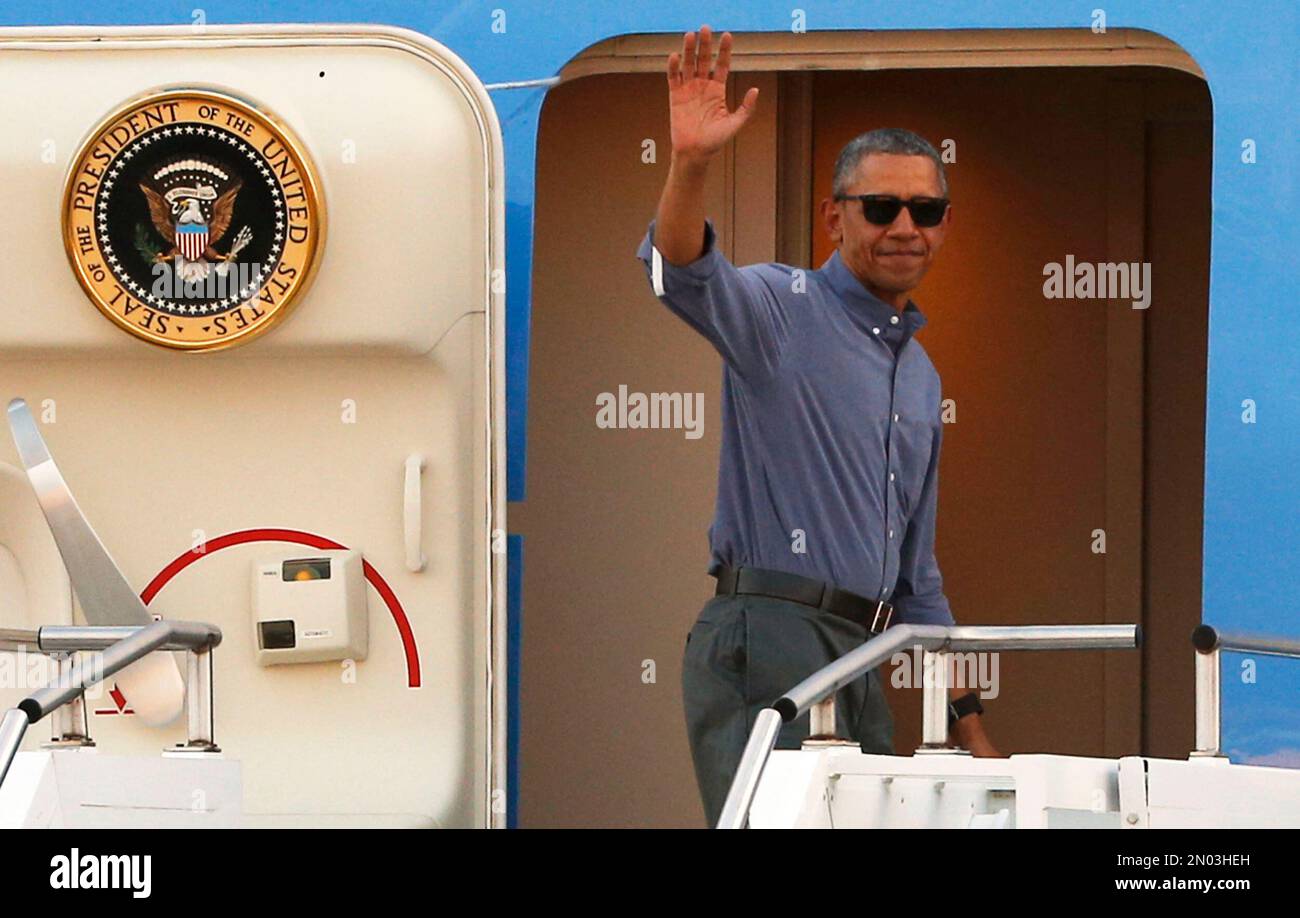 President Barack Obama waves before departing on Air Force One at Love ...