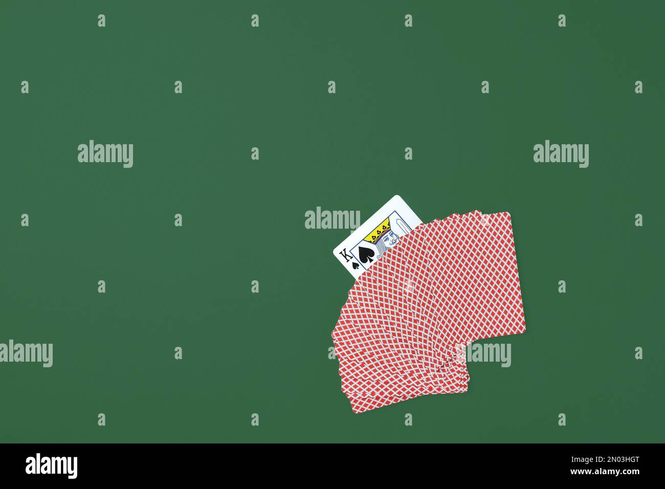 Full deck of playing cards on green background. Card of King of Spades ...