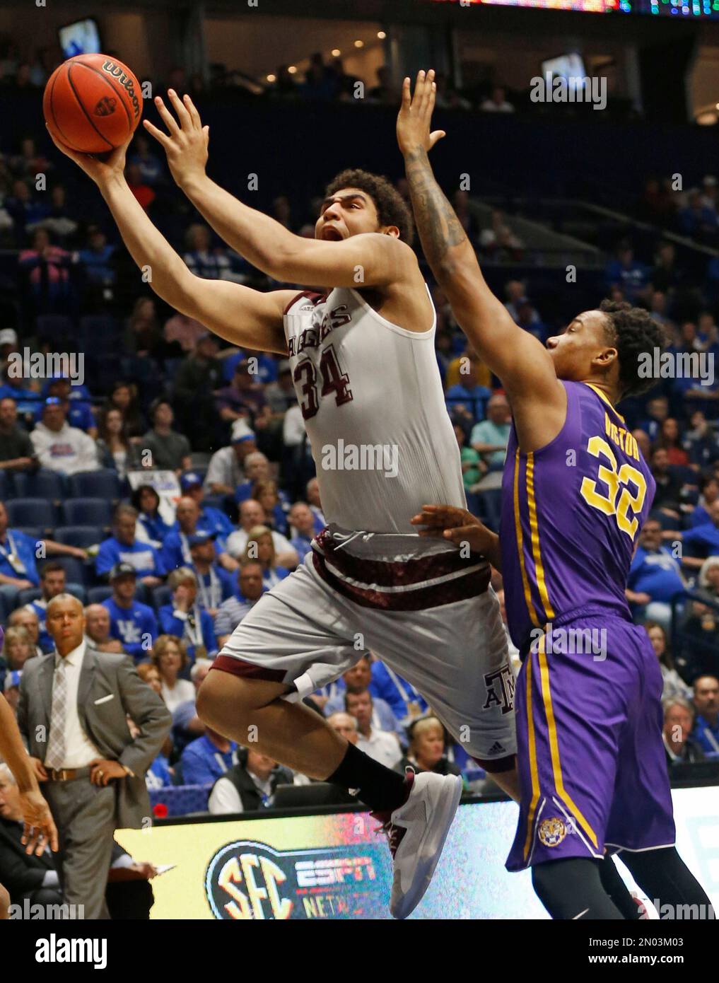 Texas A&M's Tyler Davis (34) shoots past LSU's Craig Victor II (32 ...