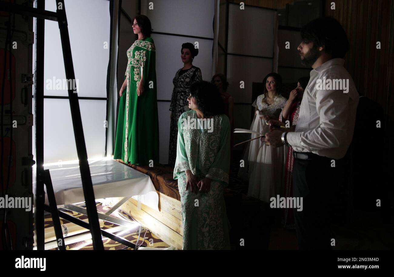Iraqi models including Saha al-Rubaye, left, line up for the catwalk at ...