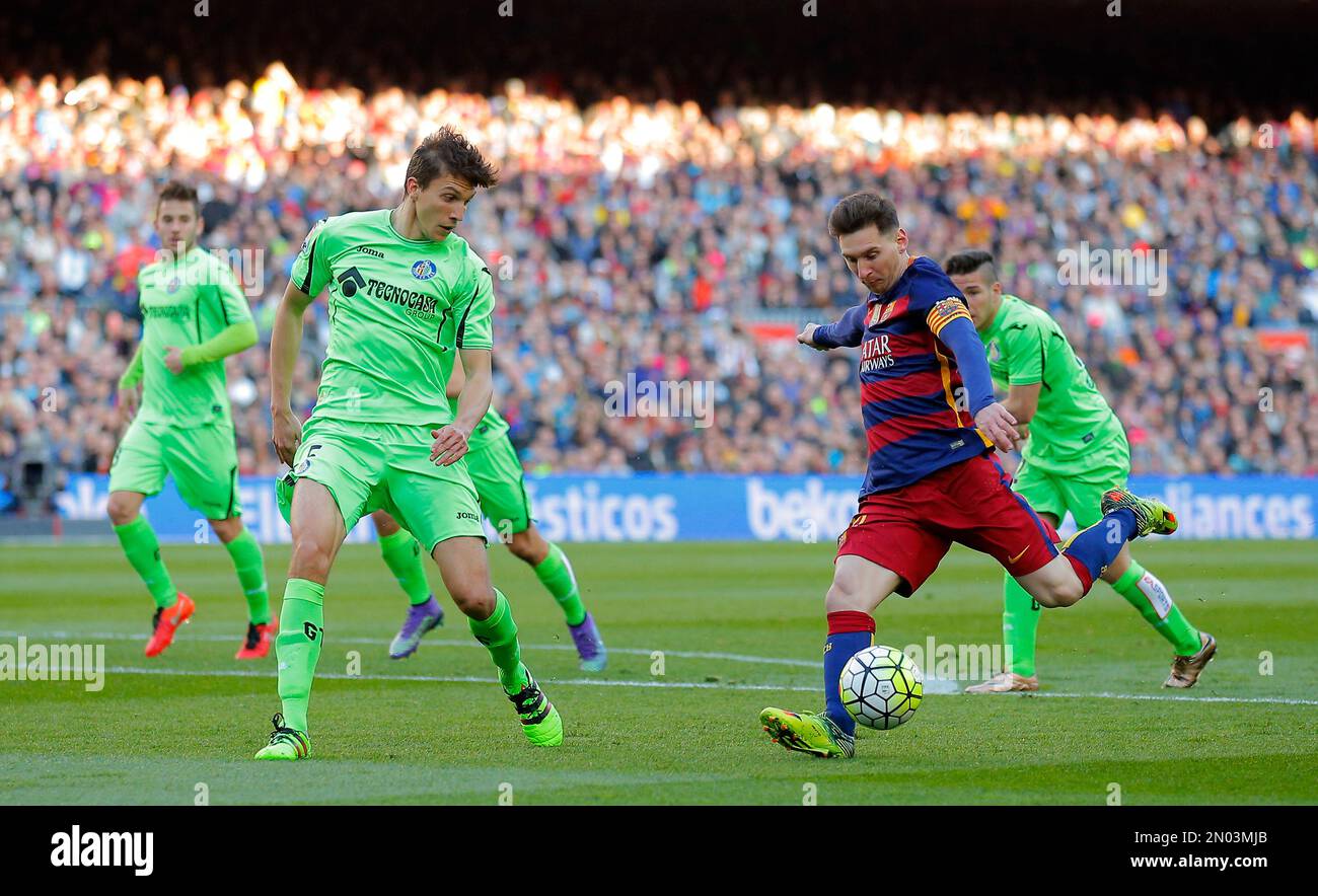 FC Barcelona's Lionel Messi, second right, duels for the ball against ...