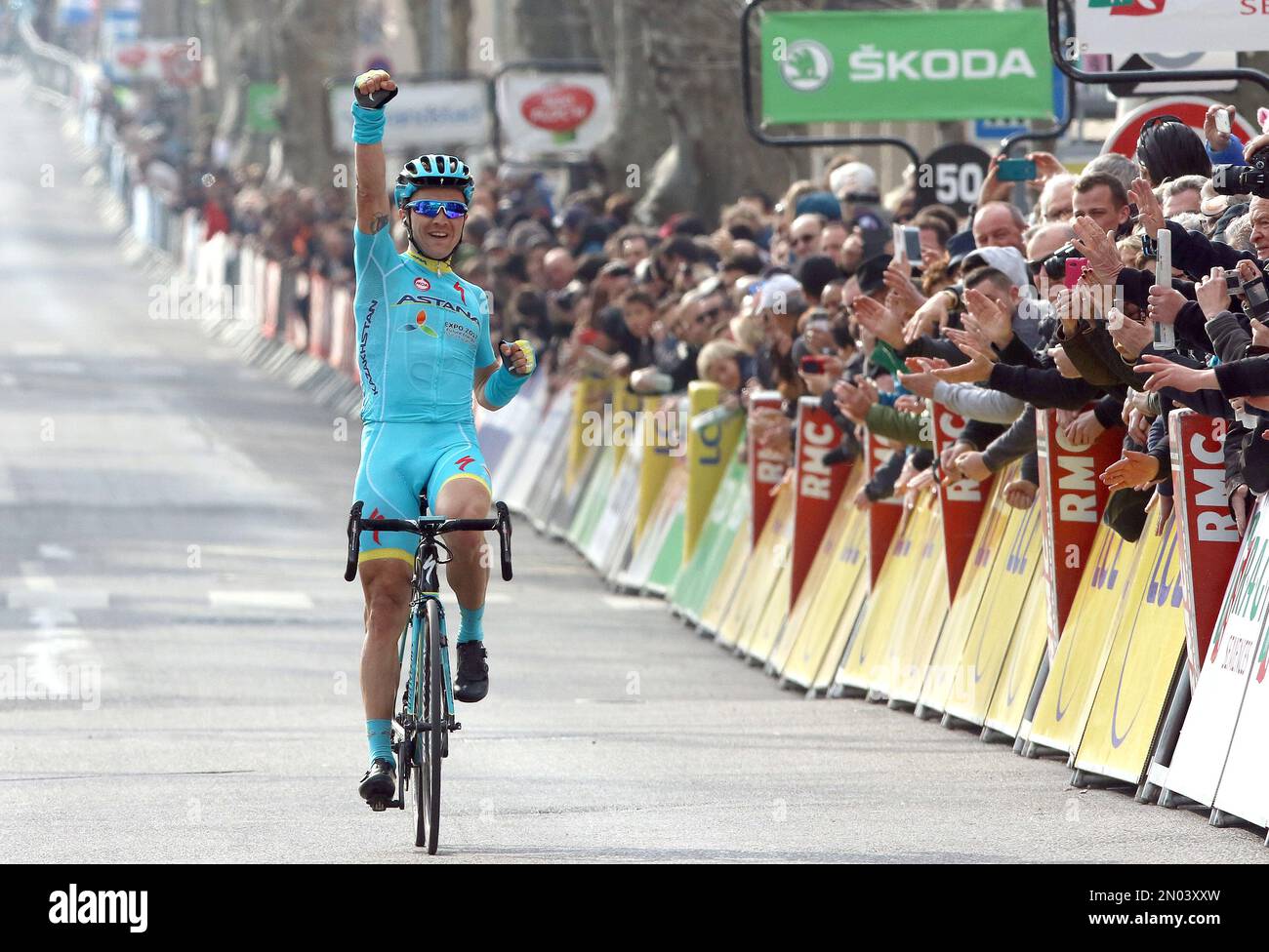 Astana Pro Team's Alexey Lutsenko celebrates before he crosses the ...
