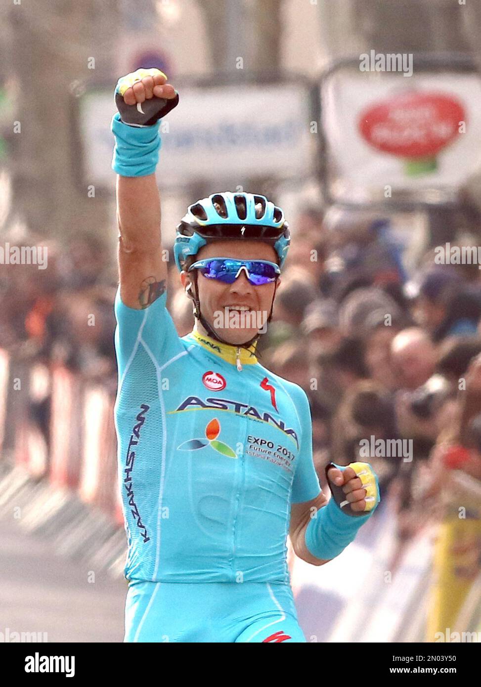 Astana Pro Team's Alexey Lutsenko celebrates as he crosses the finish ...