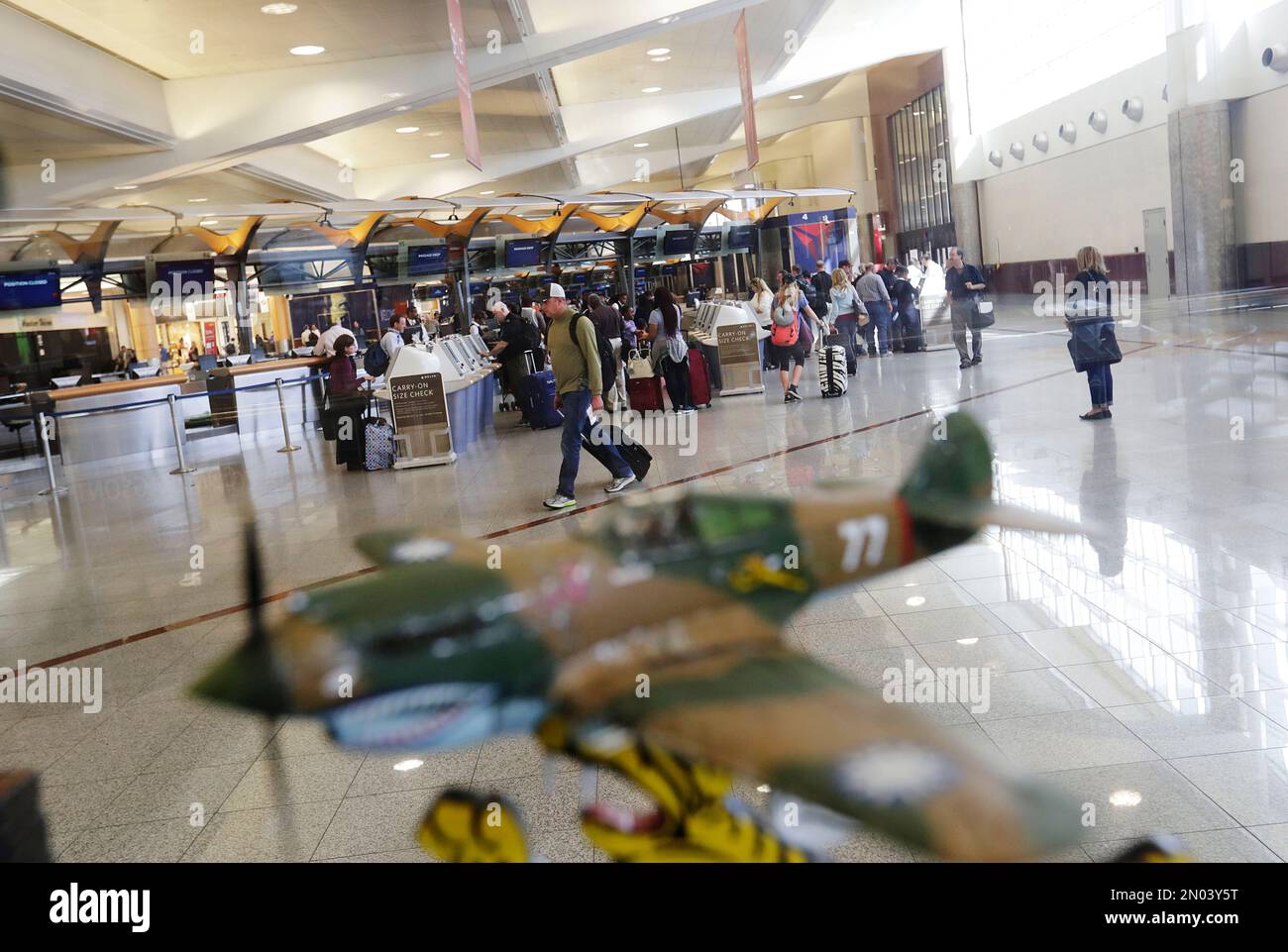 Passengers walk through the North terminal of the domestic passenger ...