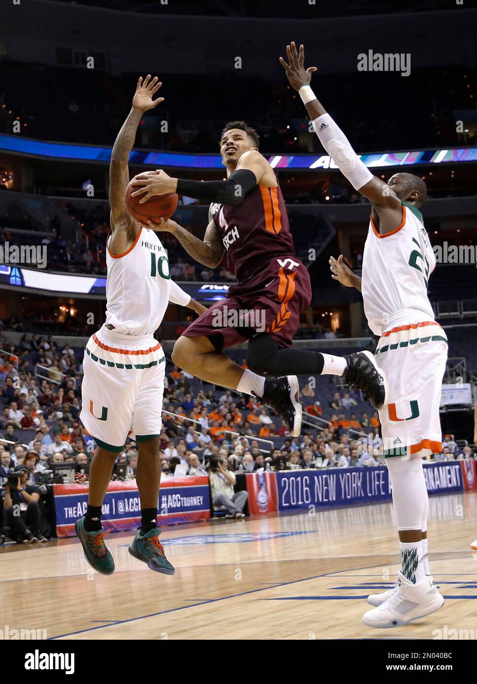 Virginia Tech guard Seth Allen (4) drives between Miami guard Sheldon ...