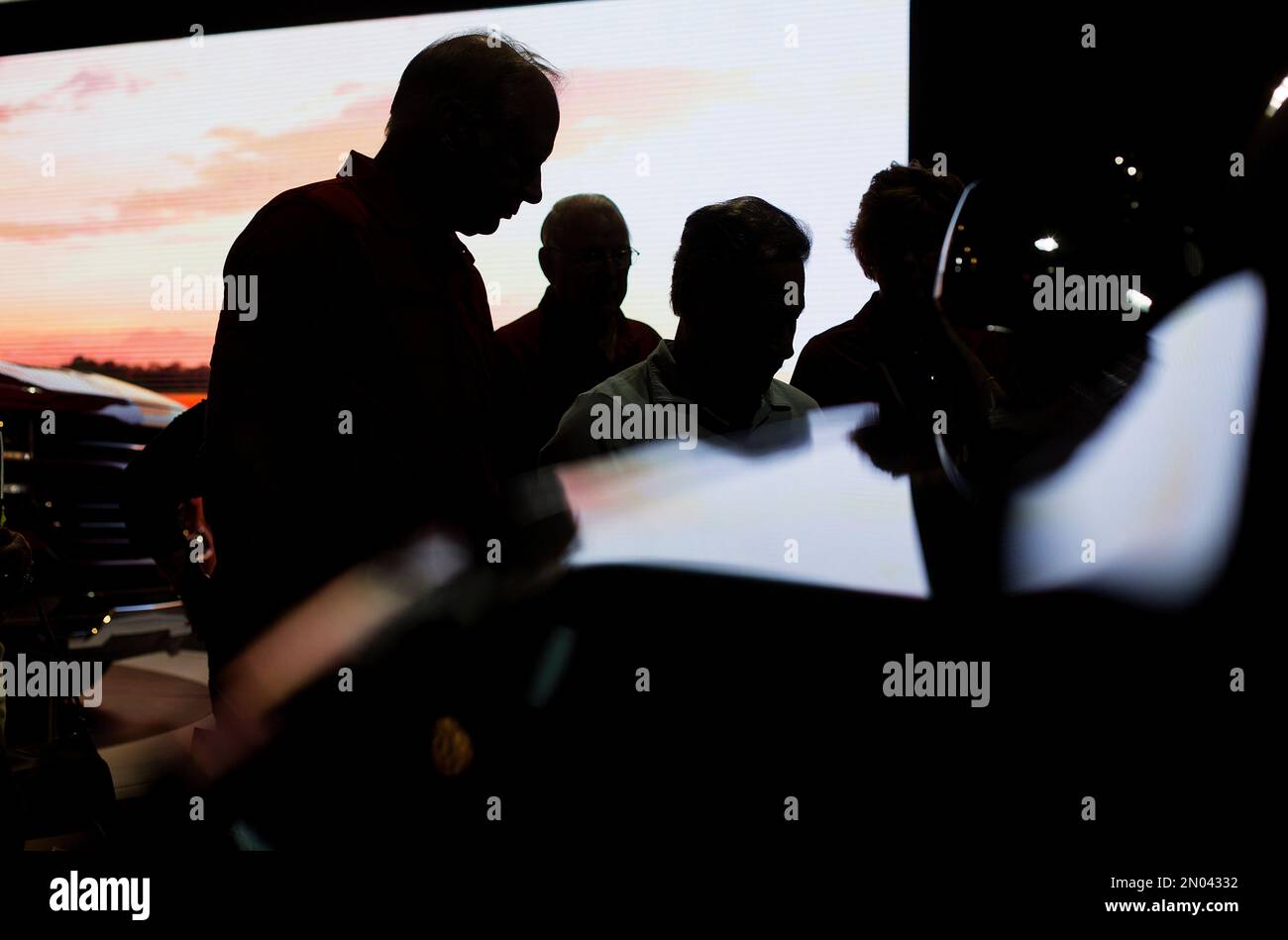Spectators look at a Chevy Tahoe at the Atlanta International Auto Show ...