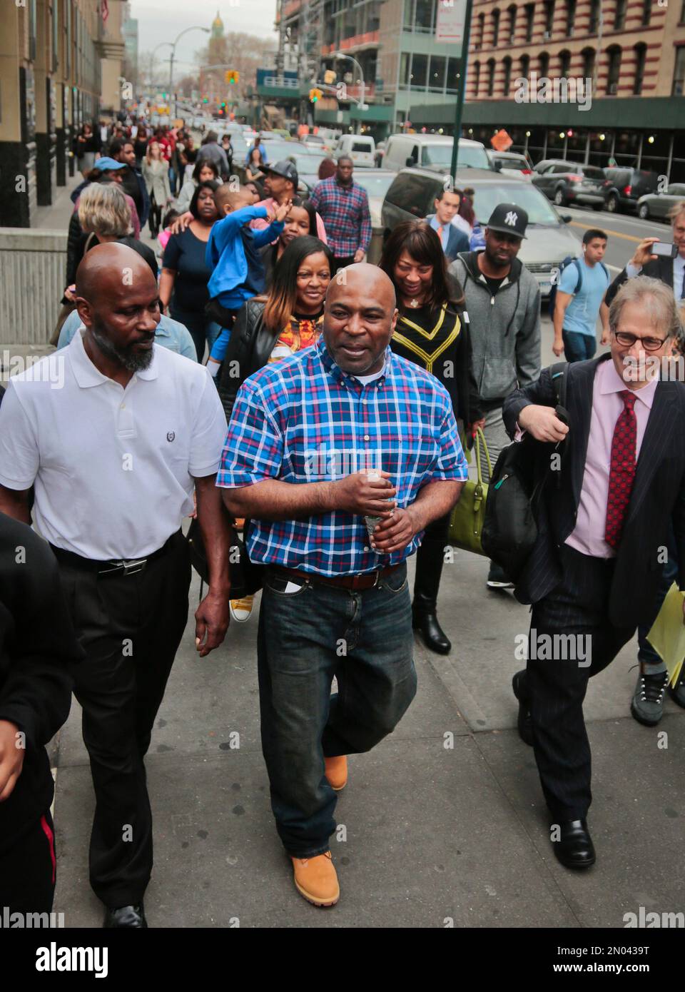 Andre Hatchett, center, walks from court followed by family after his ...