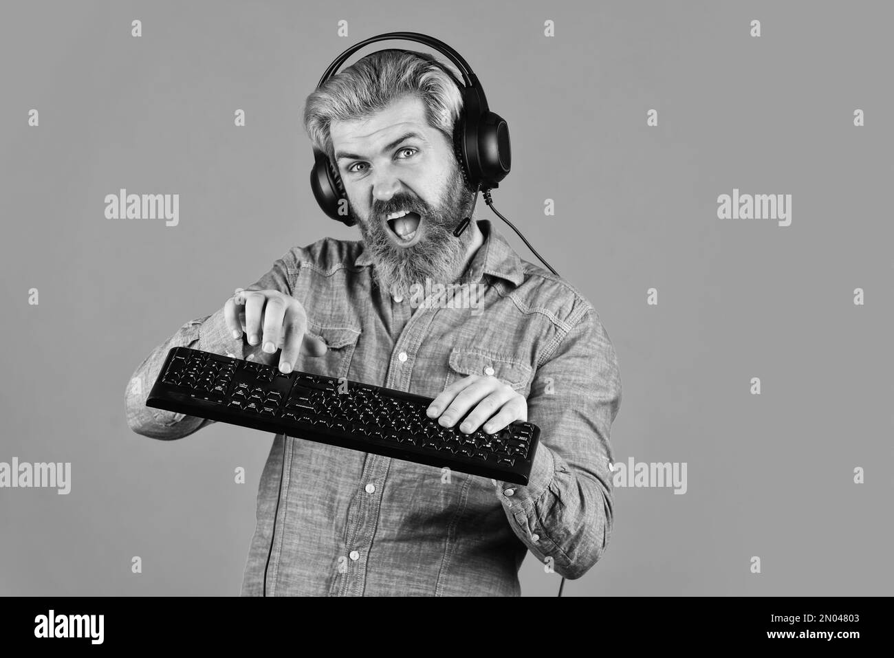 Graphics settings pushed to limit. Play computer games. Man bearded ...