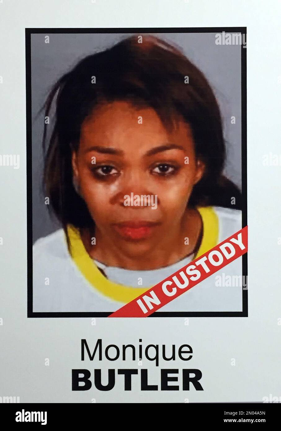 A photo of Monique Butler is shown on a poster at a news conference ...