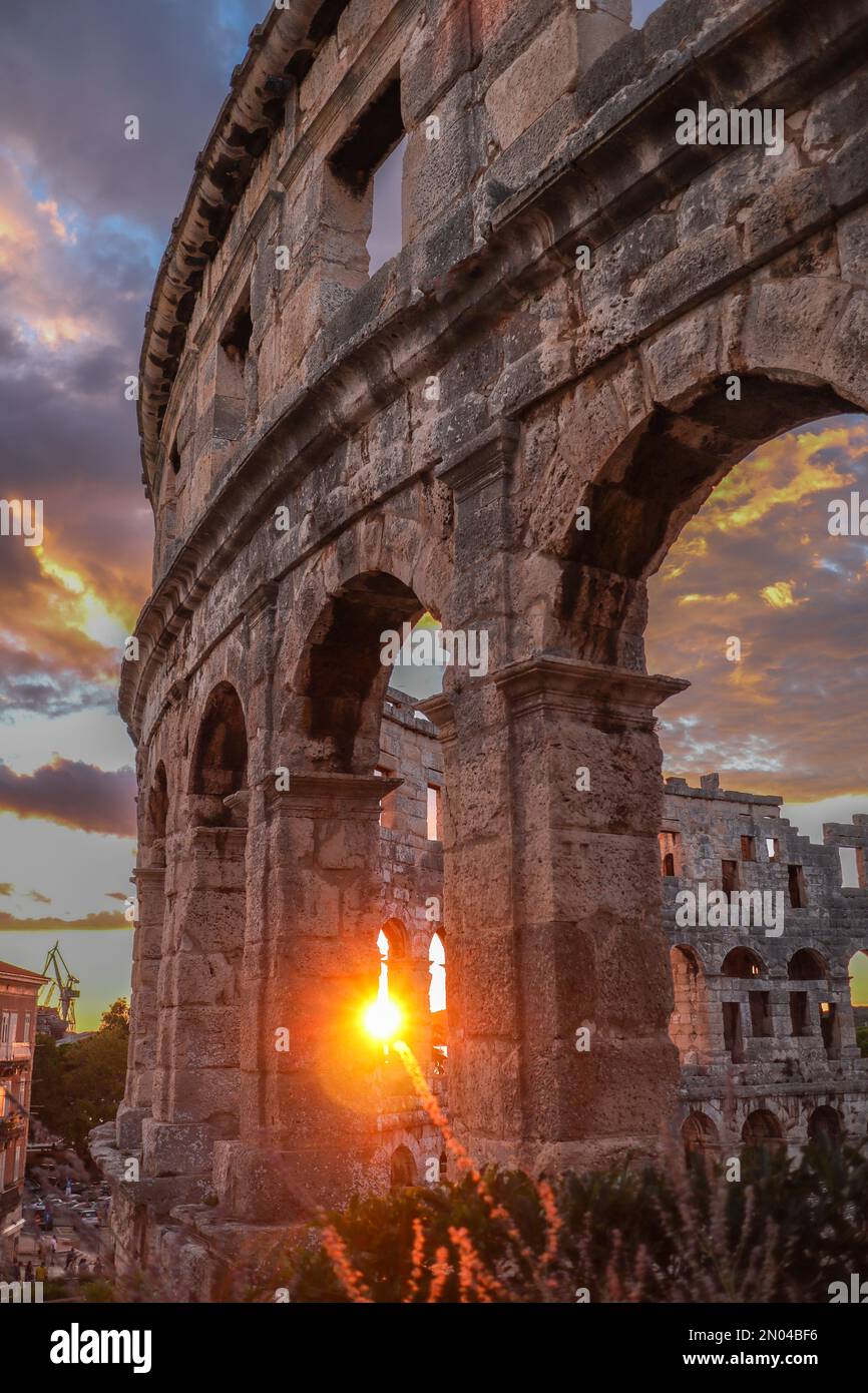 Sunset Sky with Pula Arena. Arch Roman Amphitheatre during Golden Hour ...
