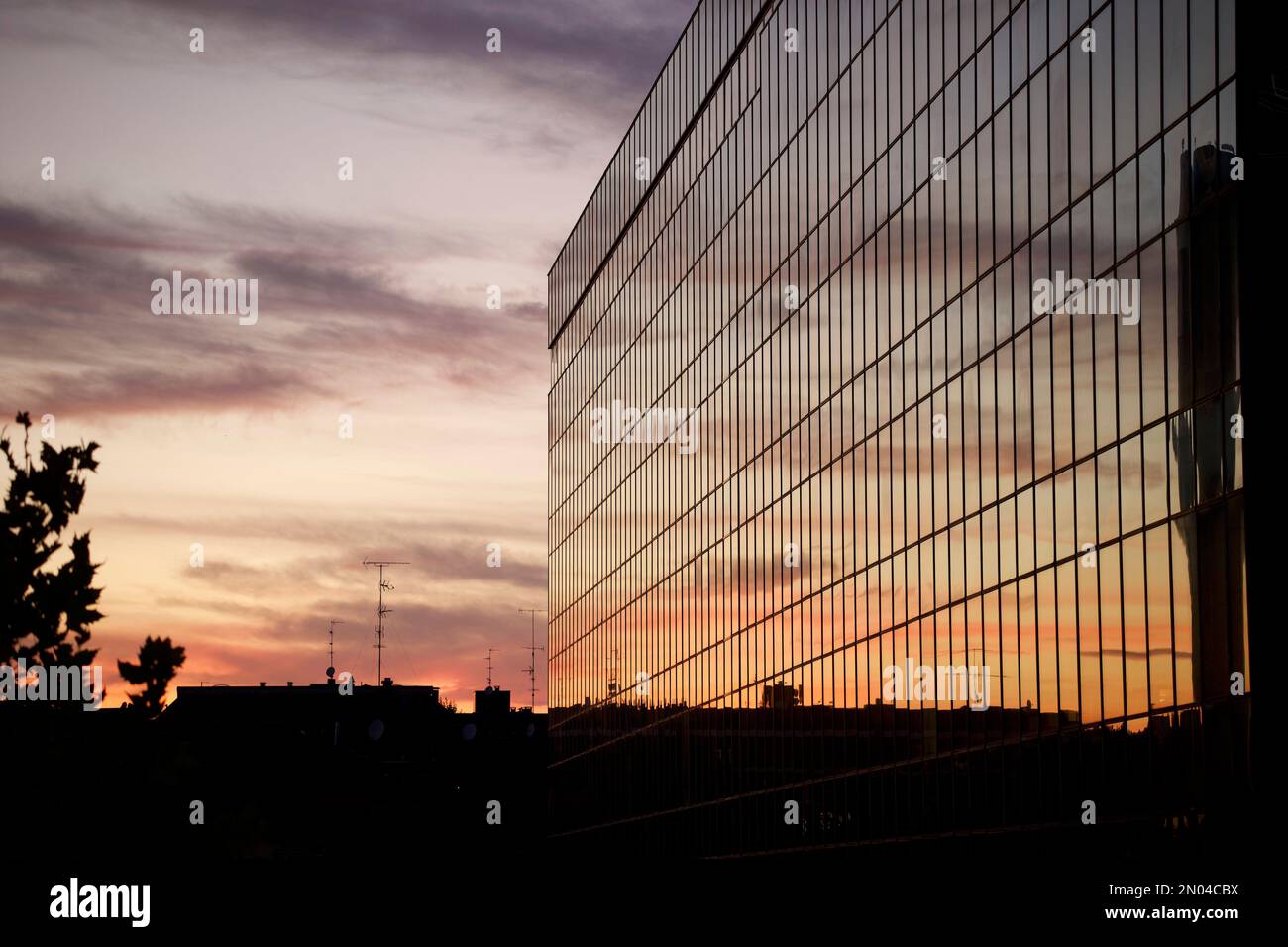 Sunset reflect glass building hi-res stock photography and images - Alamy