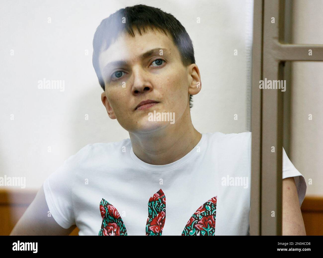 Ukrainian jailed military officer Nadezhda Savchenko sits in a glass ...