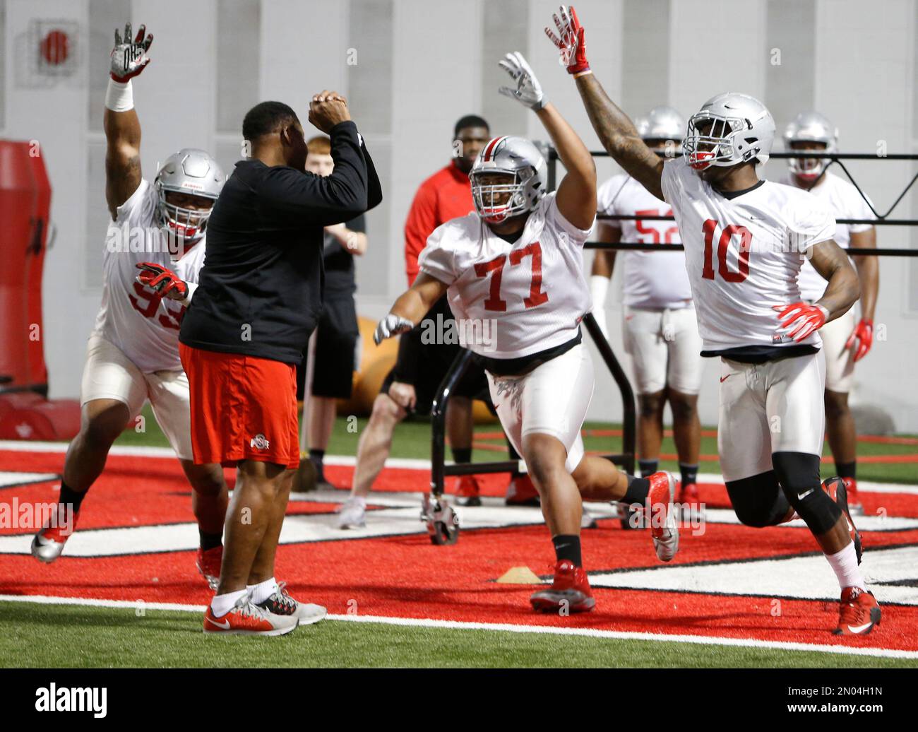 Ohio State defensive linemen Tracy Sprinkle, left to right, Michael ...