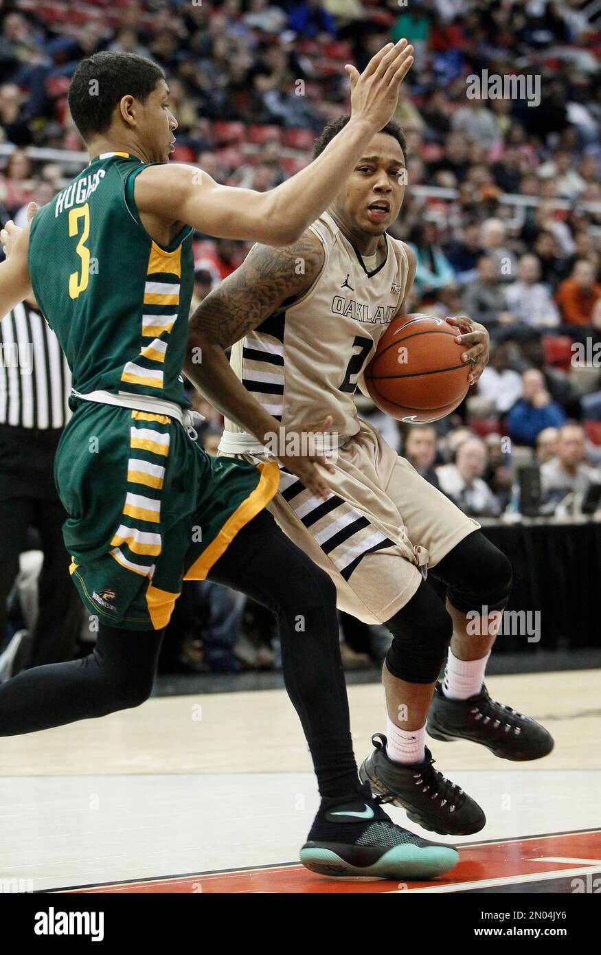 Oakland's Nick Daniels (2) drives against Wright State's Mark Hughes (3 ...