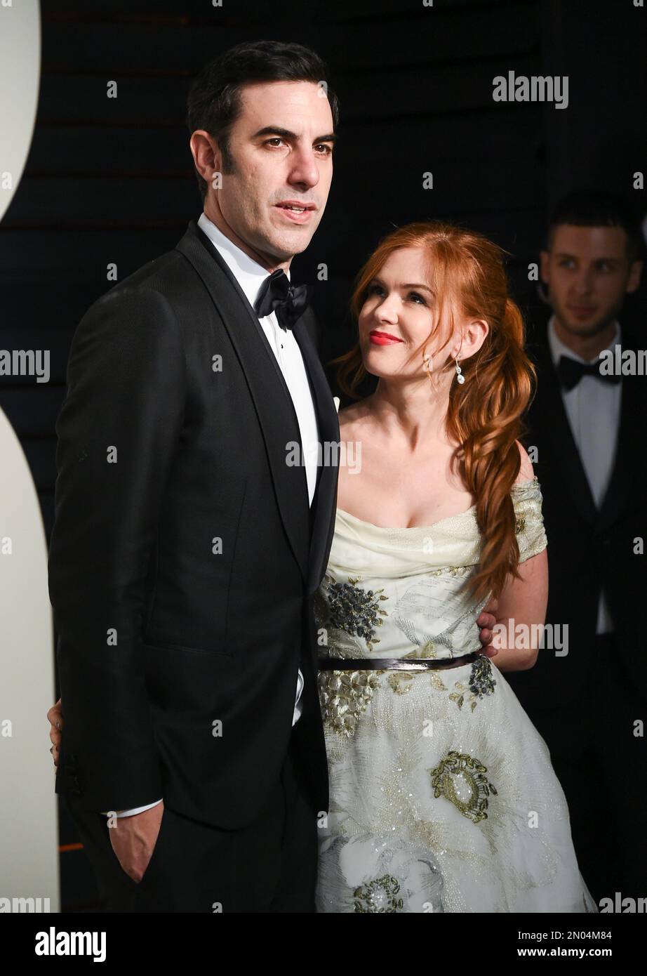 Sacha Baron Cohen, left, and wife Isla Fisher attend the Vanity Fair ...