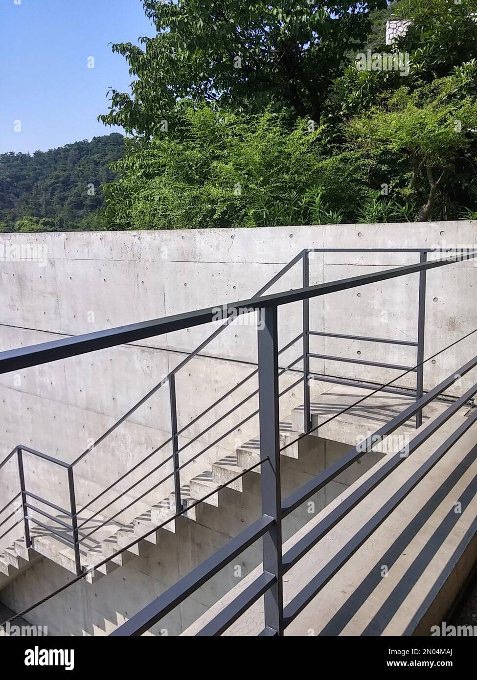 This Aug. 4, 2015 photo shows stair rails and shadows forming patterns ...