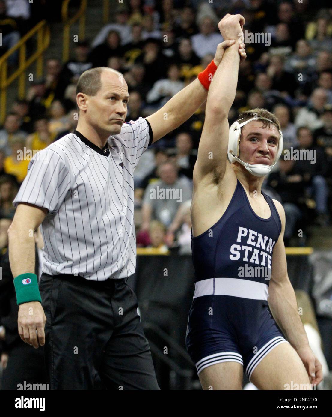 Penn State's Zain Retherford, right, has his arm raised after defeating ...
