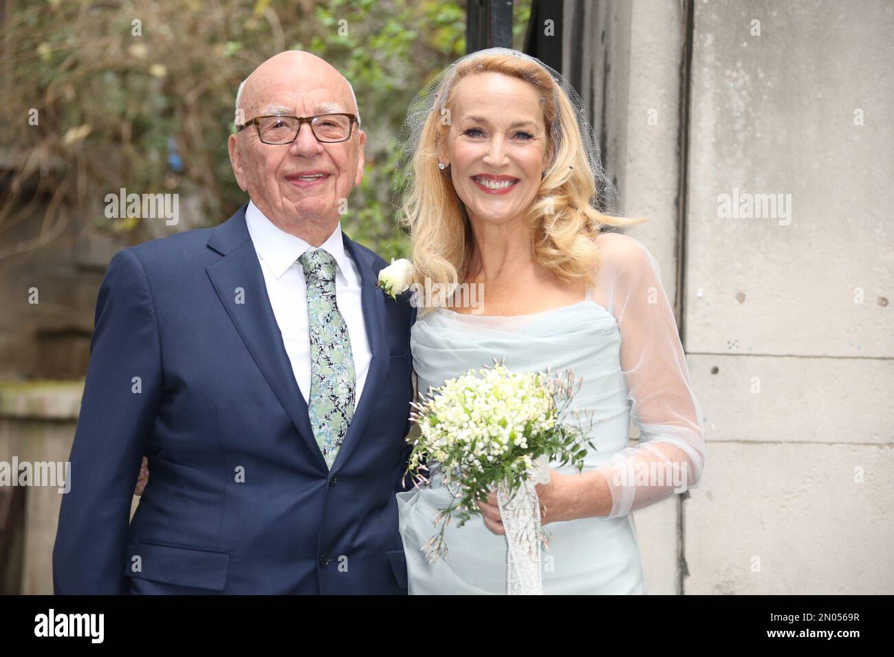 Rupert Murdoch, left, and Jerry Hall leave St Bride's Church after the ...
