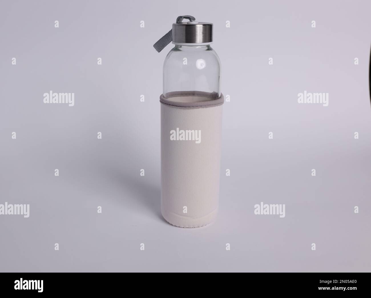 glass water bottle with white color pouch and metal cap stock image ...