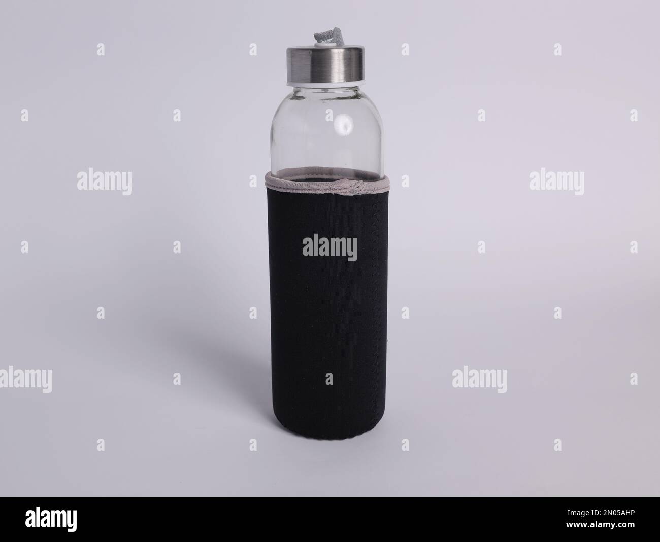 glass water bottle with black color pouch and metal cap stock image ...
