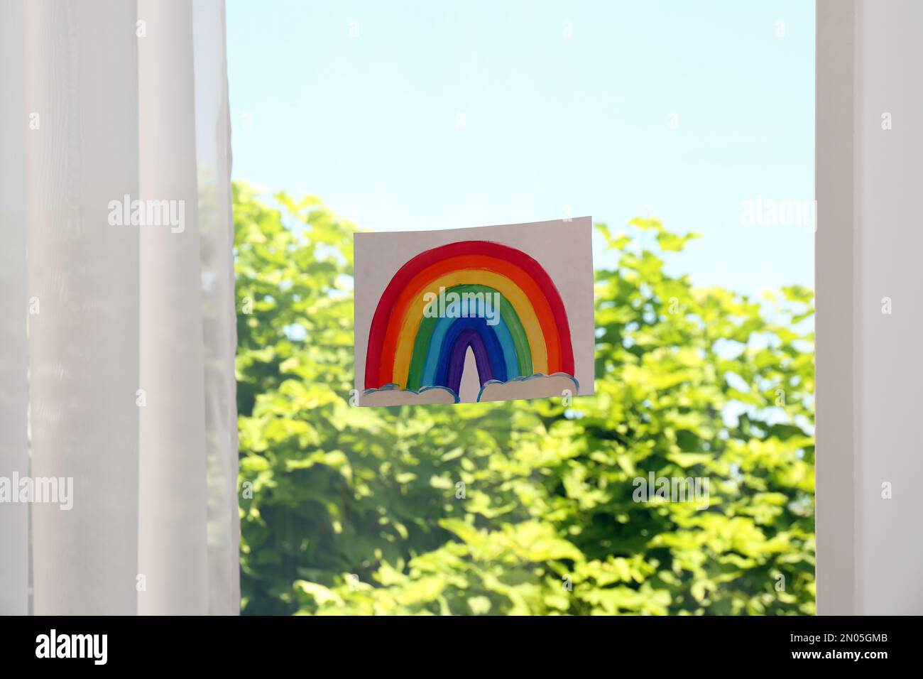 Picture of rainbow on window glass indoors. Stay at home concept Stock ...