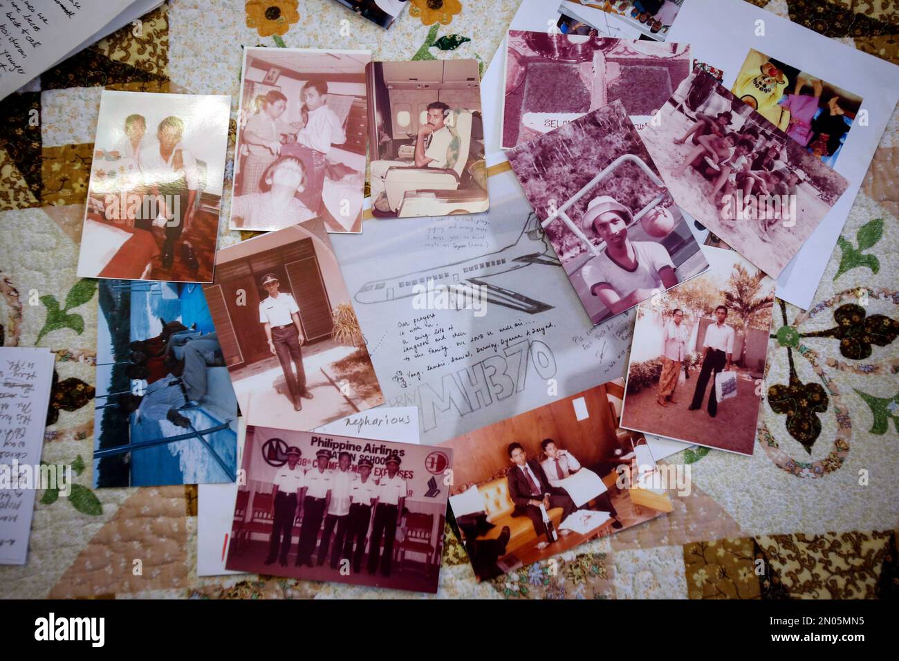 In this Feb. 28, 2016, photo, a collection of photos belonging to ...