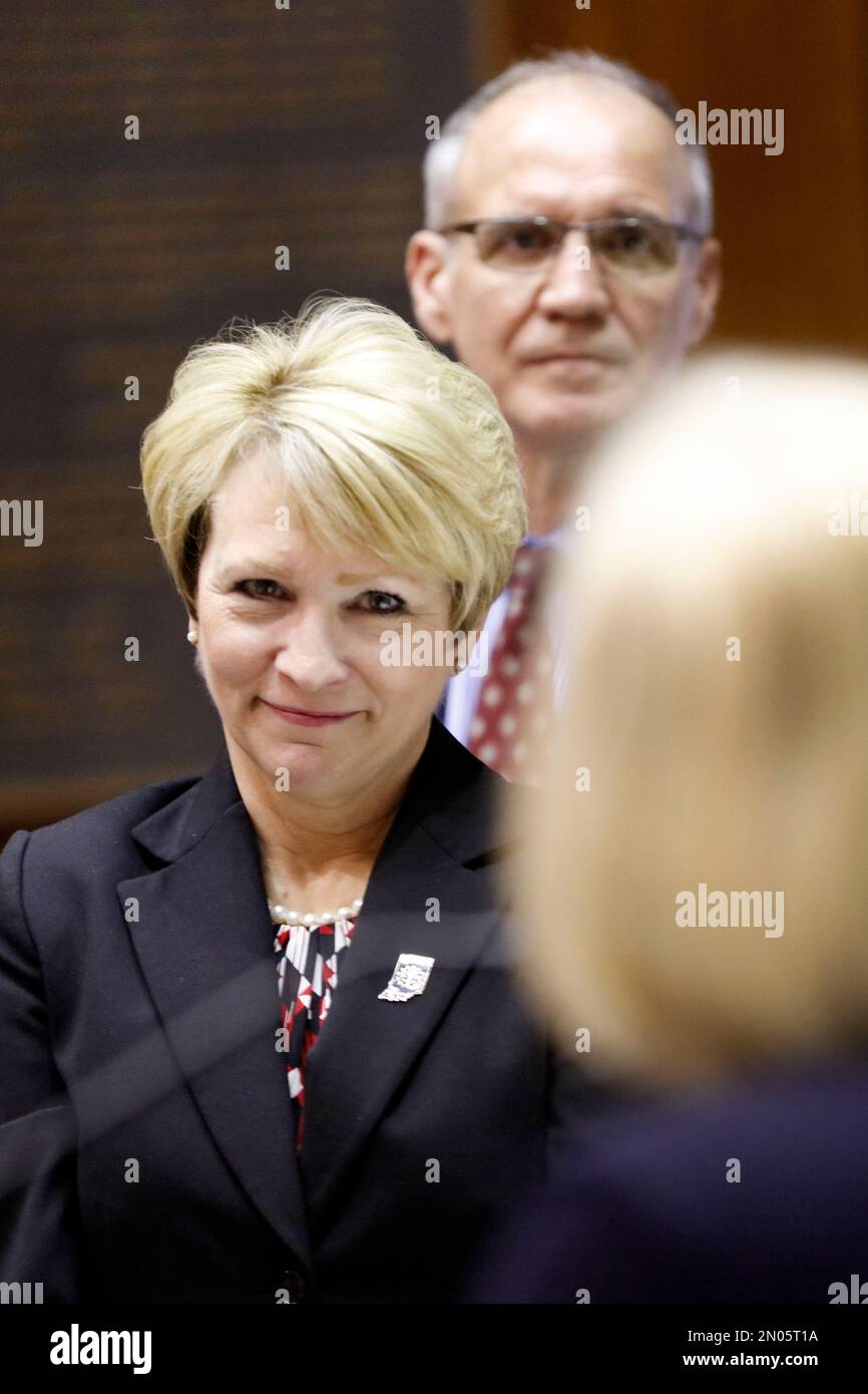 Indina Lt. Governer Sue Ellspermann listens as representative Terri ...