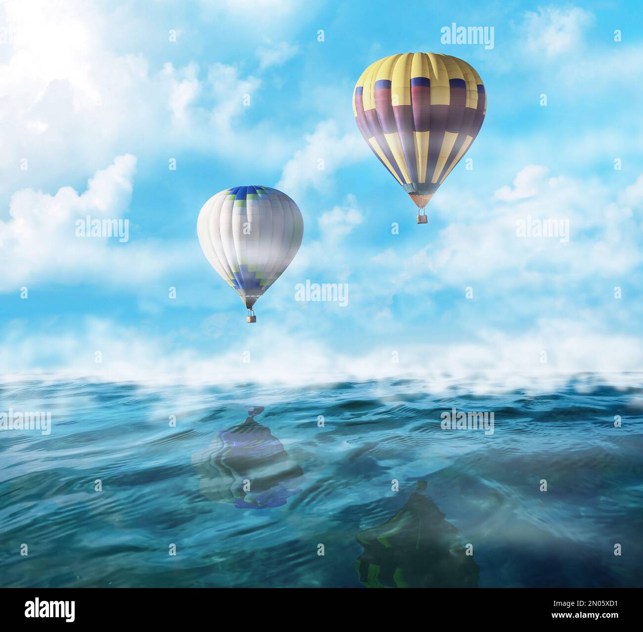 Dream world. Hot air balloons in sky with clouds over misty sea Stock ...