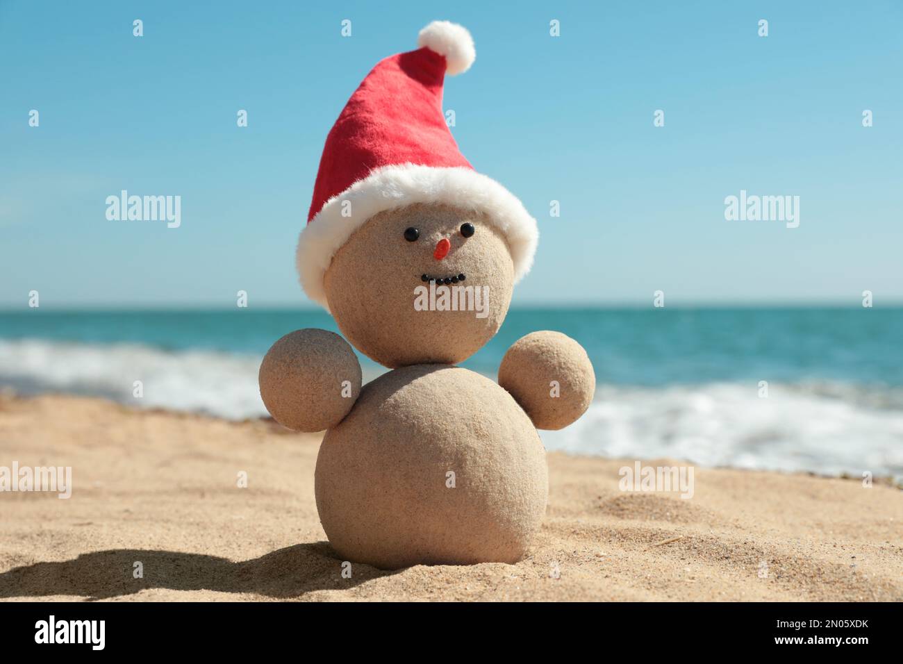 Snowman made sand on beach hi-res stock photography and images - Alamy