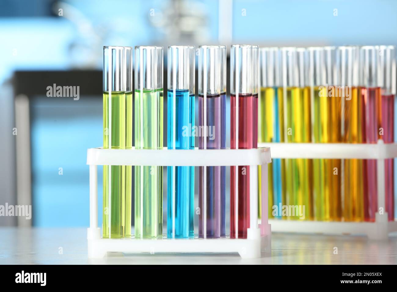 Test tubes with liquid samples on table. Laboratory analysis Stock ...