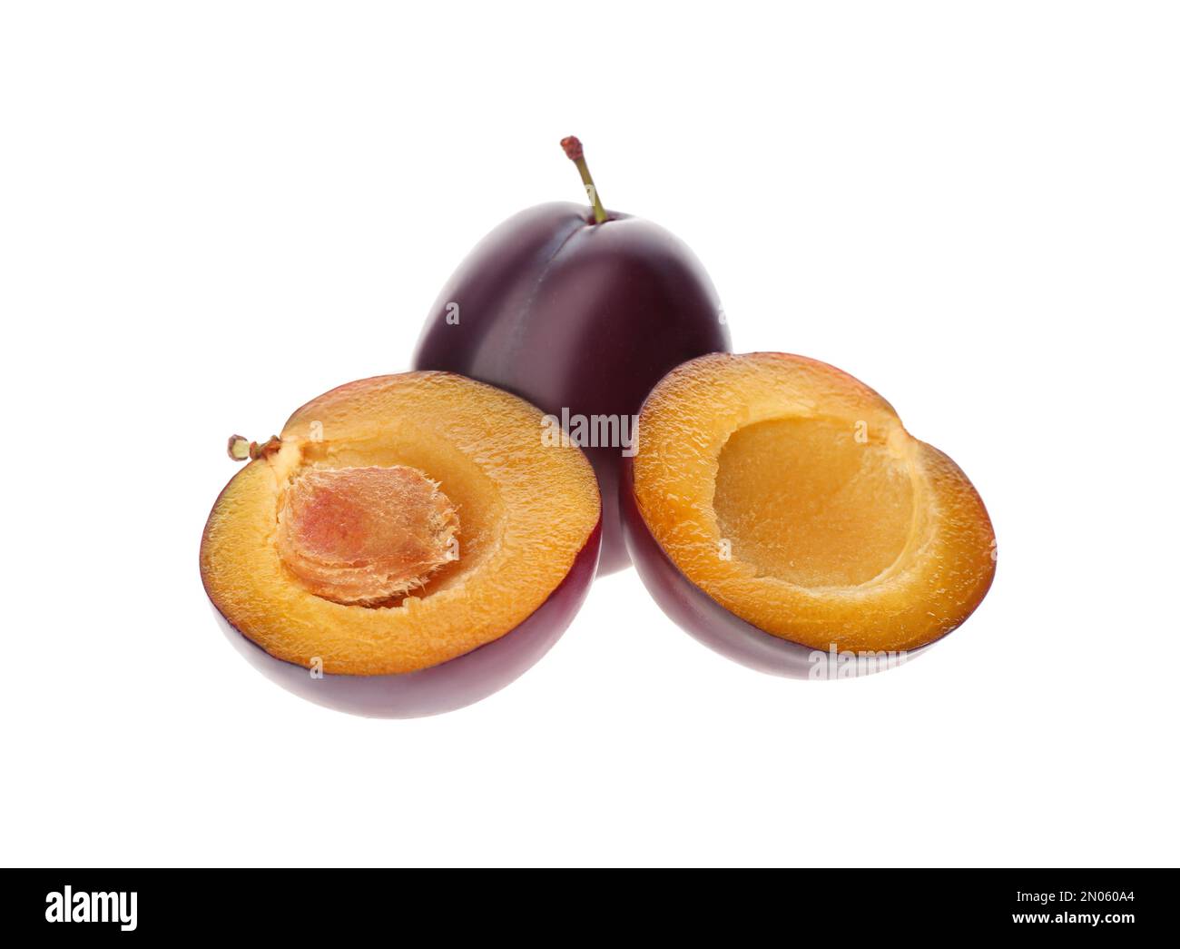 Whole and cut ripe plums isolated on white Stock Photo - Alamy