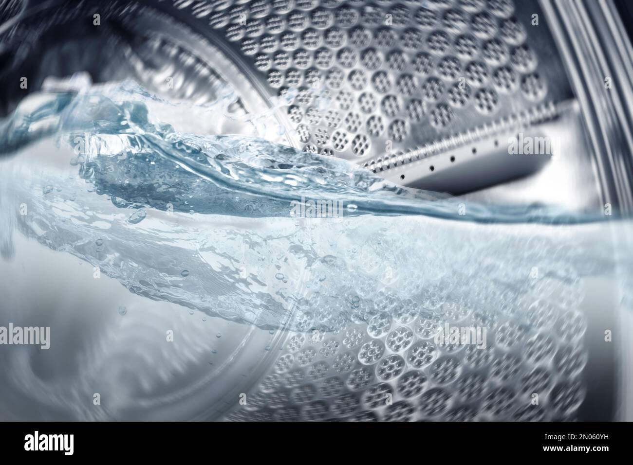 Washing machine drum with water, closeup view Stock Photo - Alamy