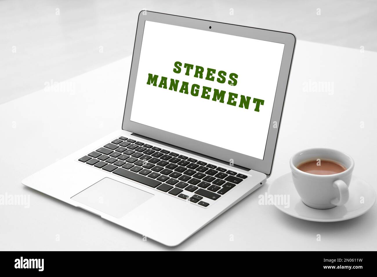 Laptop with text Stress Management on screen Stock Photo - Alamy
