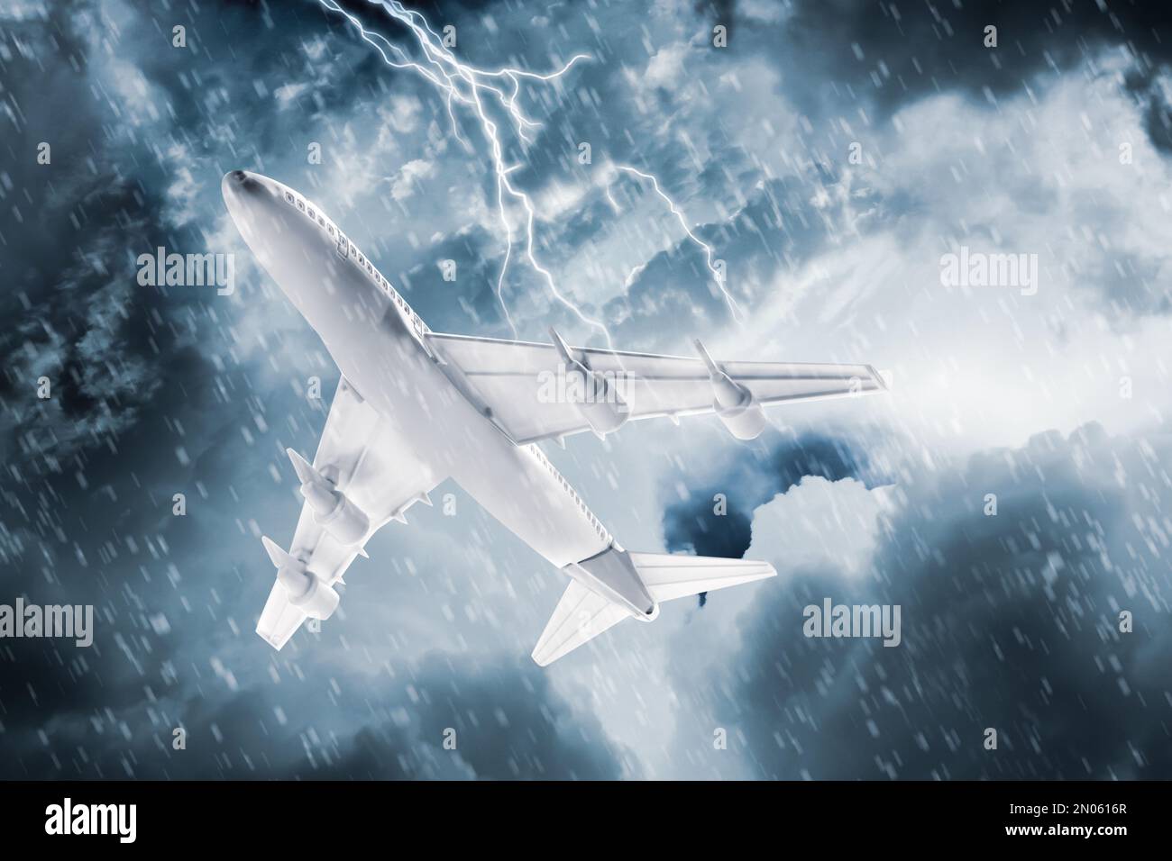 Airplane flying in cloudy sky during thunderstorm Stock Photo - Alamy