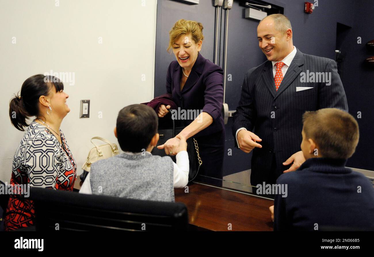 University of Connecticut president Susan Herbst, center, greets Jake ...