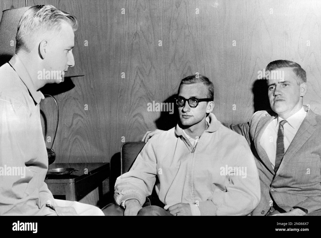 James Zwerg, 21, center, chats with his brother Charles, left, and the ...
