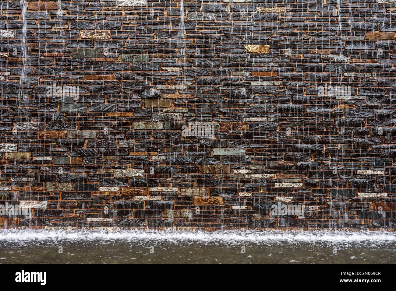 Stone wall and water stream. Background Stock Photo - Alamy