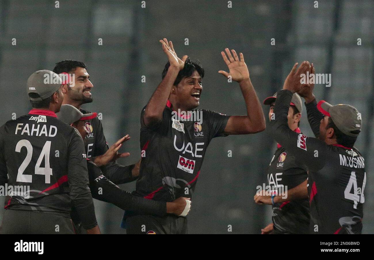 United Arab Emirates’ captain Amjad Javed, center, celebrates with his ...