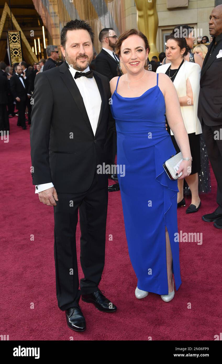Paul Norris, left, and Sara Bennett arrive at the Oscars on Sunday, Feb ...