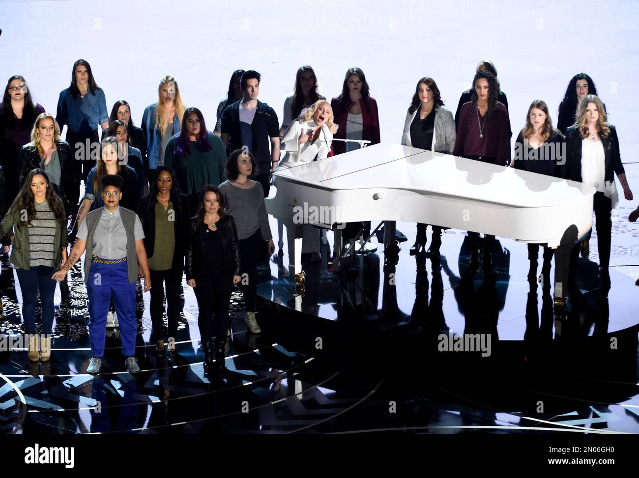 Lady Gaga performs with survivors of abuse at the Oscars on Sunday, Feb ...