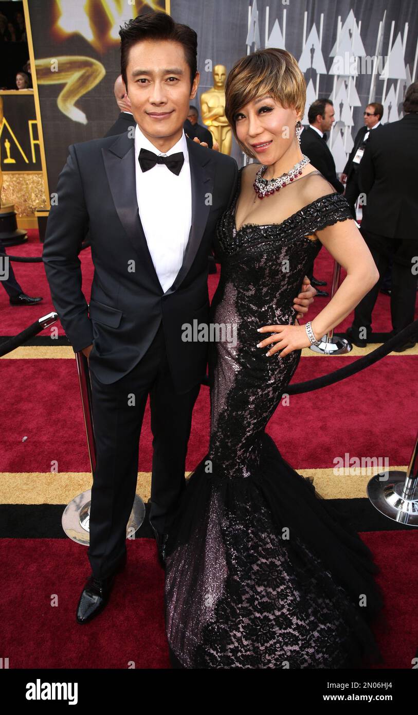 Byung-hun Lee, left, and Sumi Jo arrive at the Oscars on Sunday, Feb ...