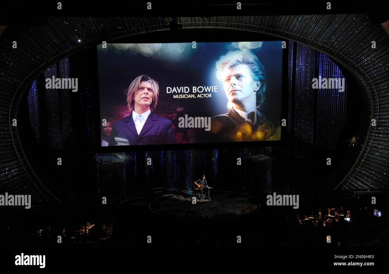 David Bowie is featured on screen during the in memoriam tribute at the ...
