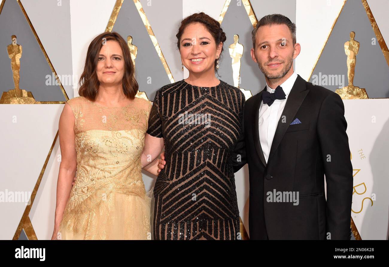 Amy Hobby, from left, Liz Garbus and Justin Wilkes arrive at the Oscars ...